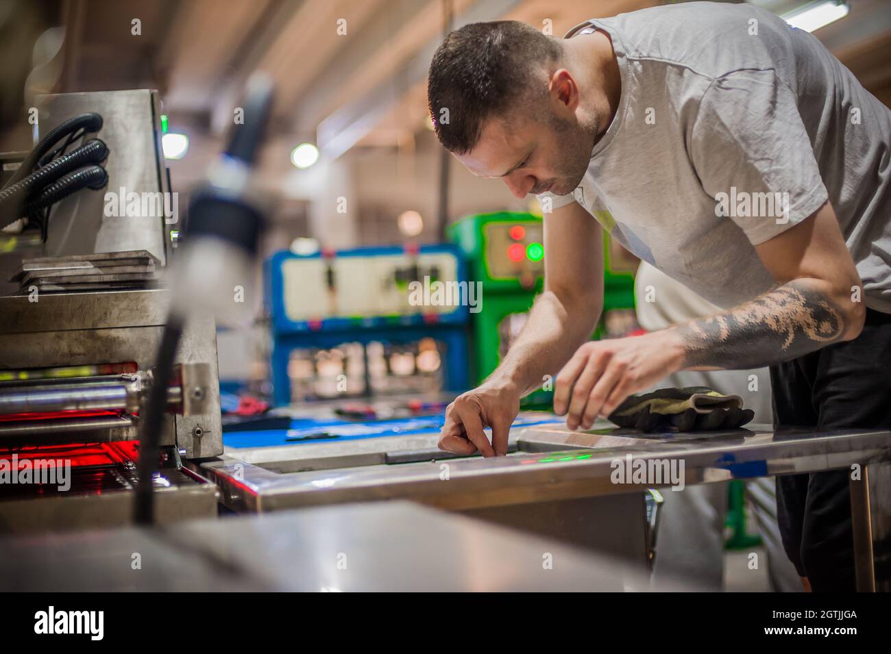 Professional worker technician machinist work in factory production ...