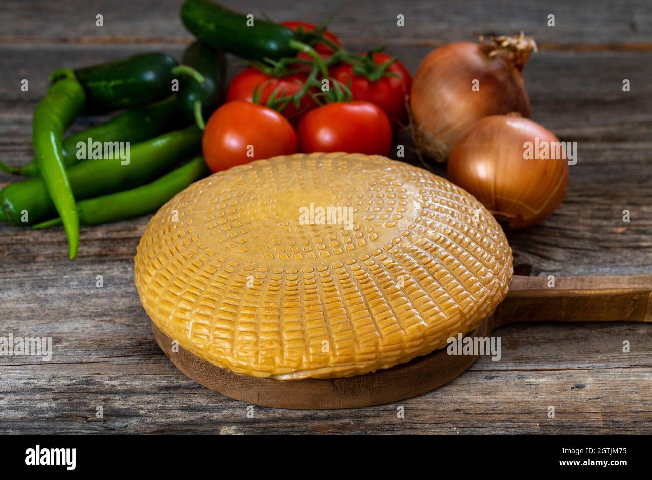 Smoked cheese on wood background Stock Photo - Alamy