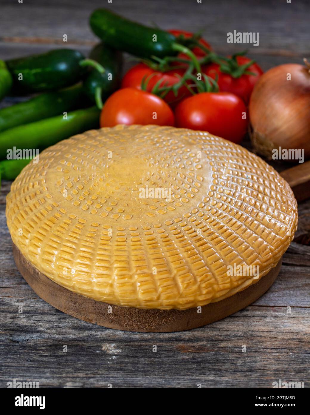 Smoked cheese on wood background Stock Photo - Alamy