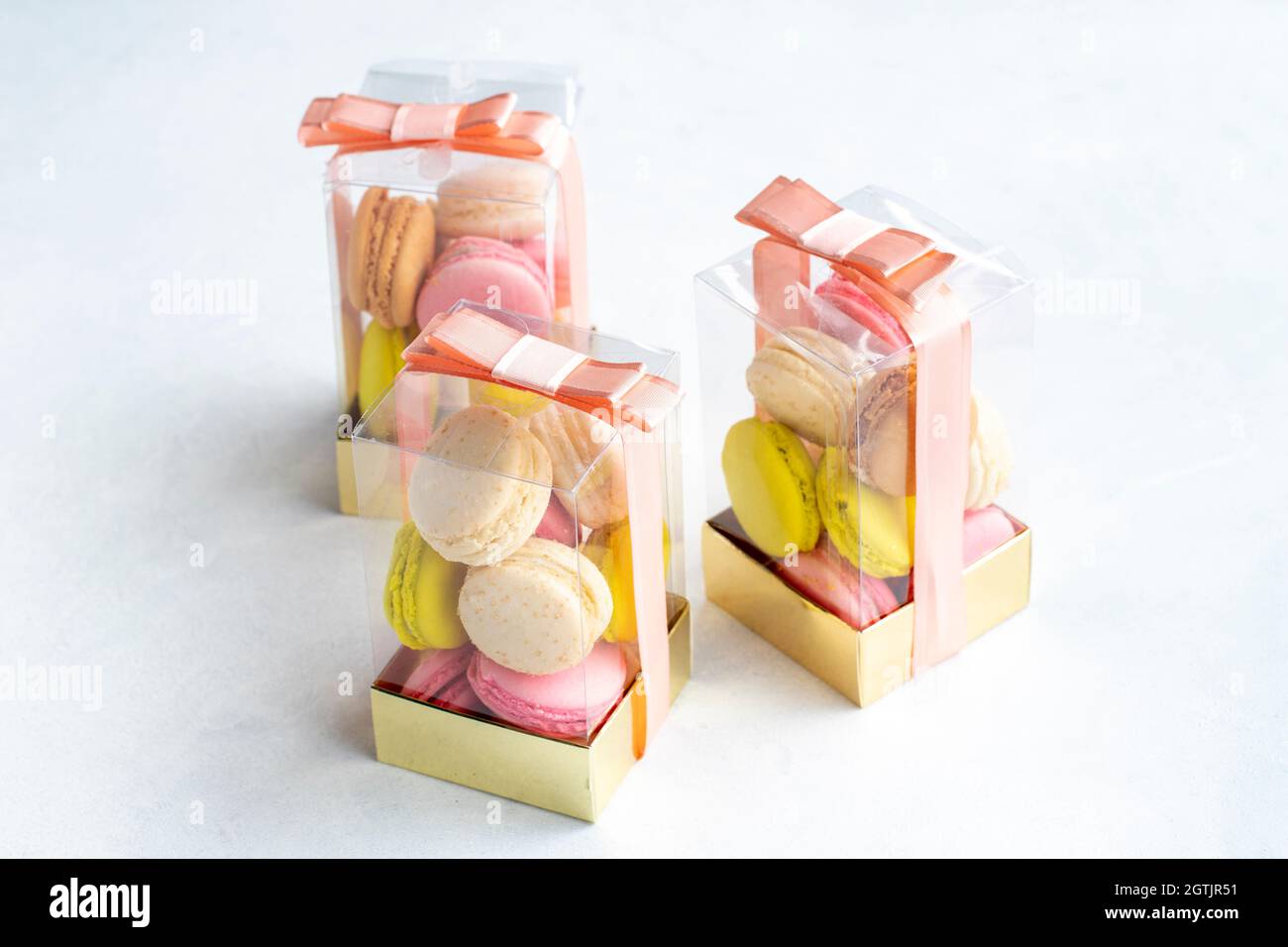 Packed macarons on a white background. Packaged macarons for gifting ...