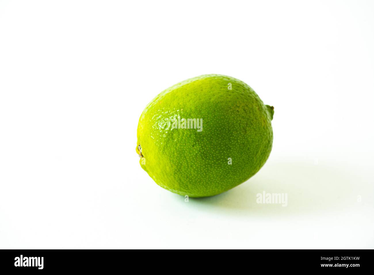 Macro Fruit: Ripe lime with white background, horizontal format with ...