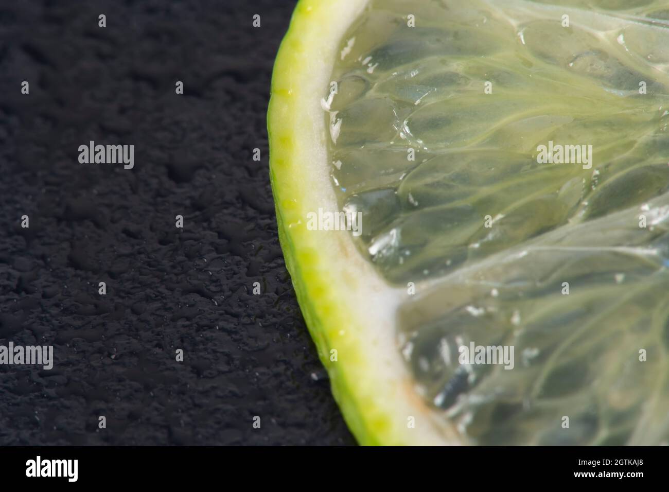 Macro fruit: Ripe lime slice extreme close-up with black background, horizontal format Stock ...