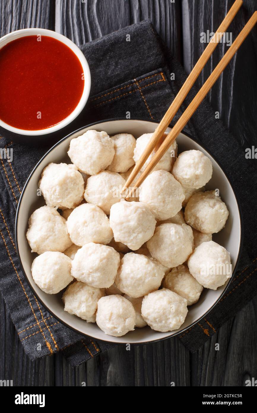 Homemade Indonesian chicken meatballs bakso ayam with sauce close up in ...