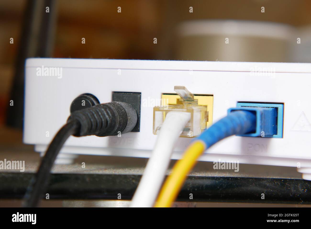 Wi-Fi router with cables on table Stock Photo - Alamy