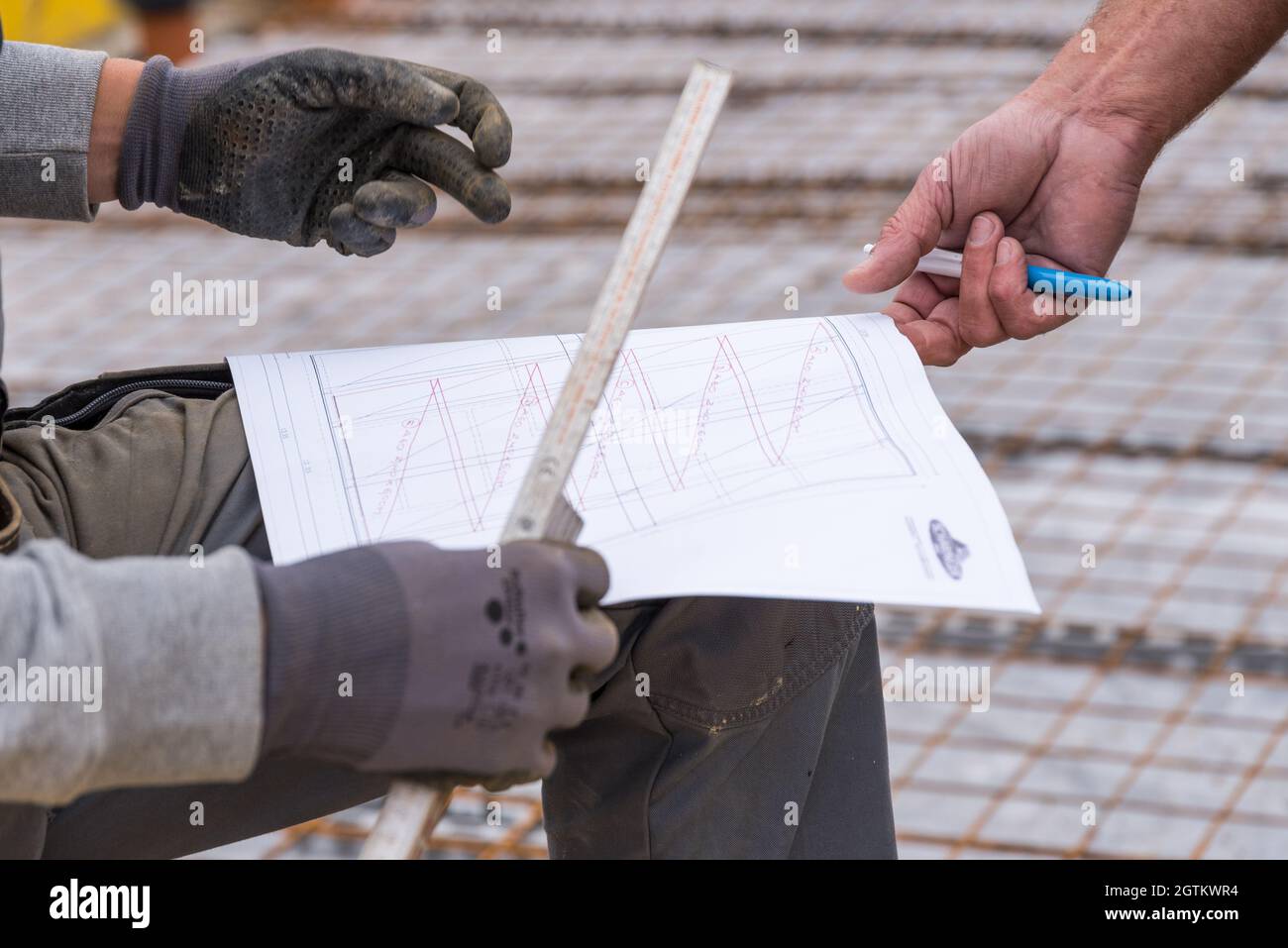 Construction Worker With Blueprint - Detail Of Building Trade Stock ...