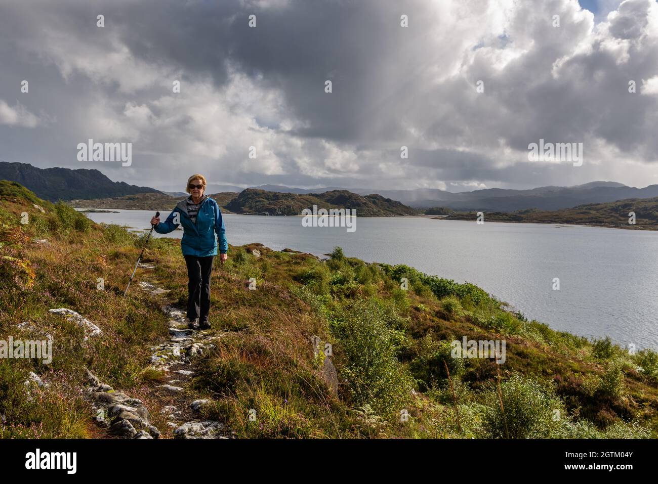 Walking the Shore path on Eilean Shona in Loch Moidart Scotland Stock ...