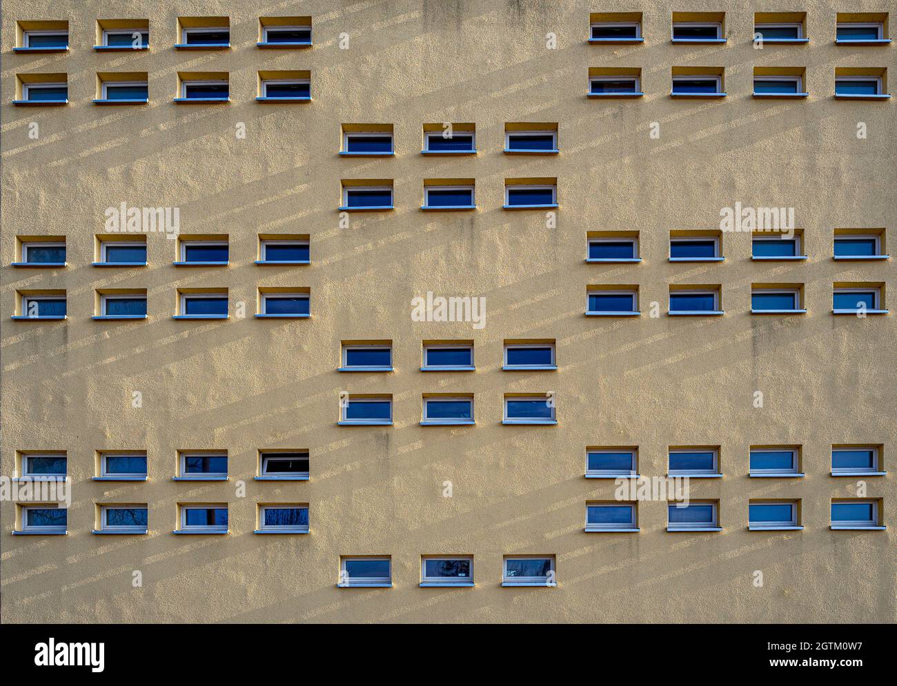 Narrow Windows On A House Facade Stock Photo - Alamy