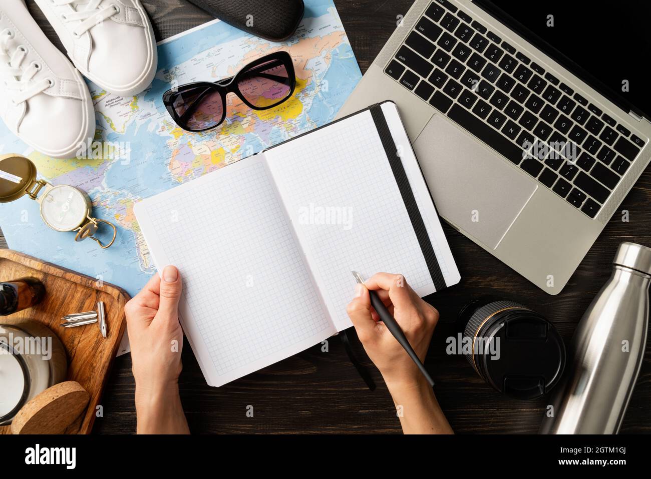 Planning a trip laptop map hi-res stock photography and images - Alamy