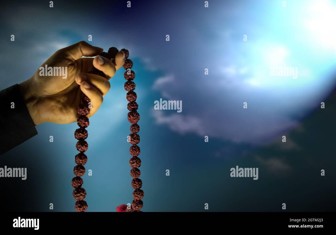 Beads in hand hi-res stock photography and images - Alamy