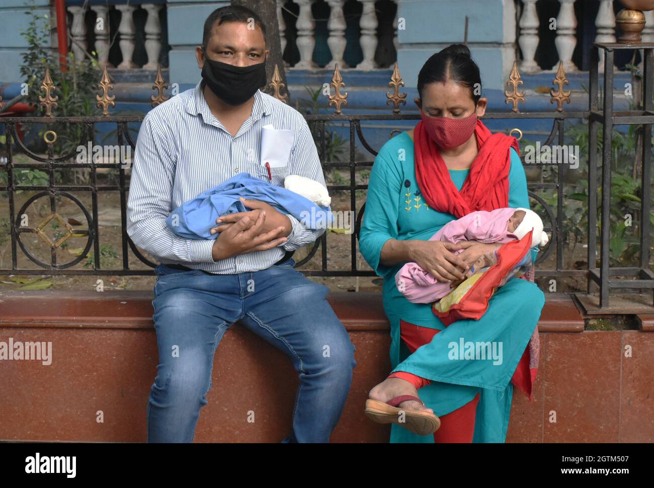 Kolkata, India. 02nd Oct, 2021. People are sitting outside a child care ...