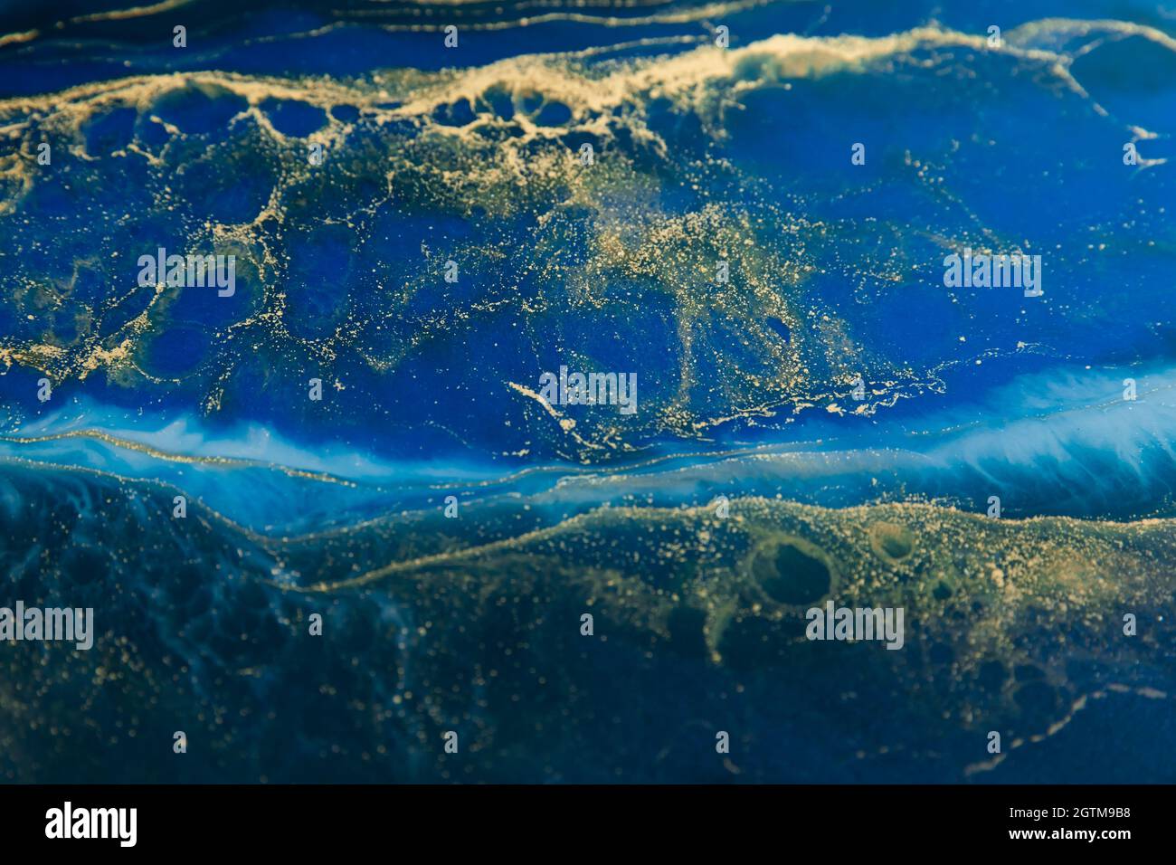 Resin art with bright blue and golden colors. Epoxy effect background ...