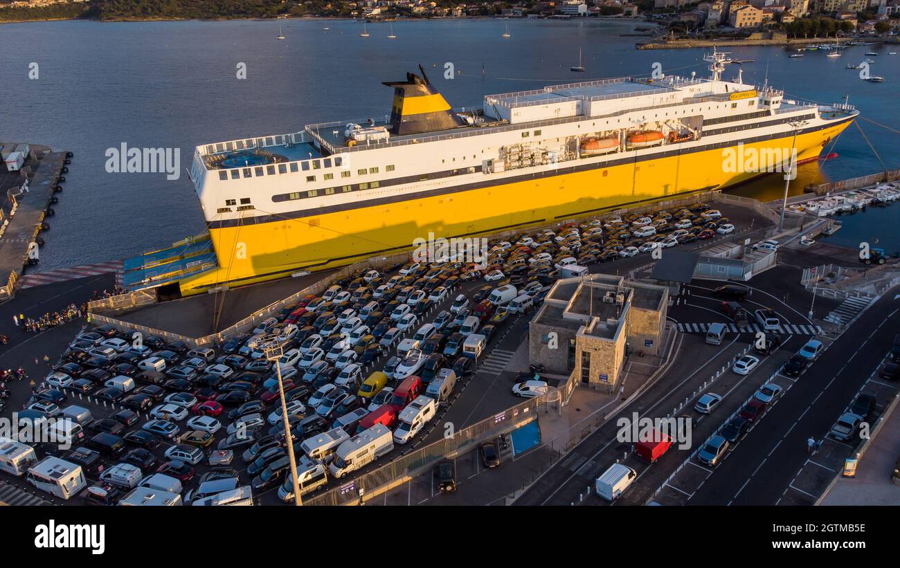Aerial view of the lighthouse on Pietra island with a yellow ferry ...