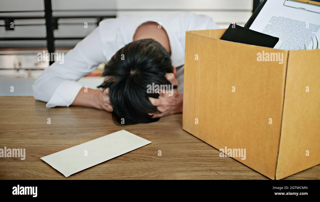 Businessman envelope table resignation hi-res stock photography and ...