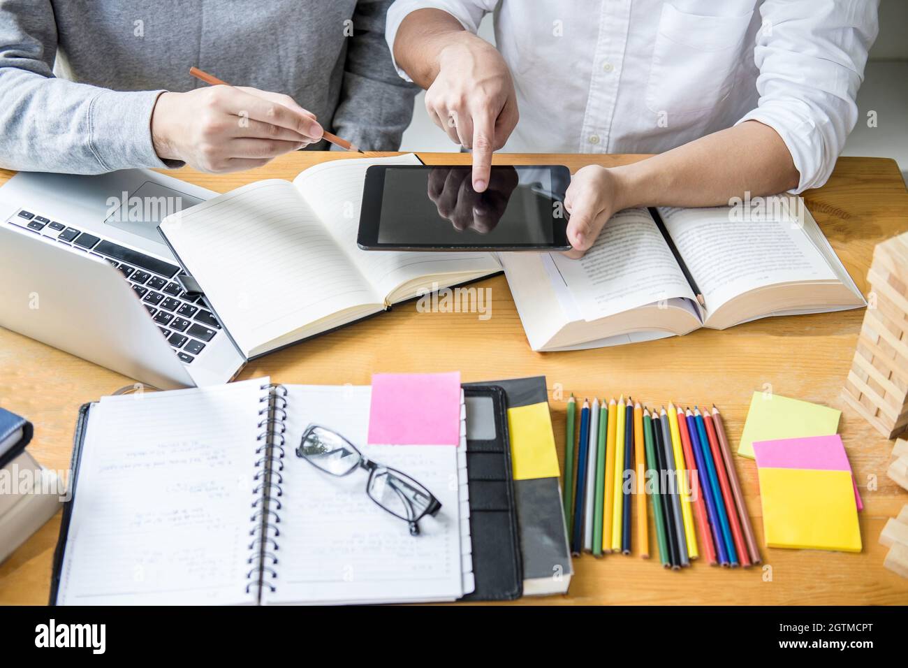 Two students discussion with paper hi-res stock photography and images ...