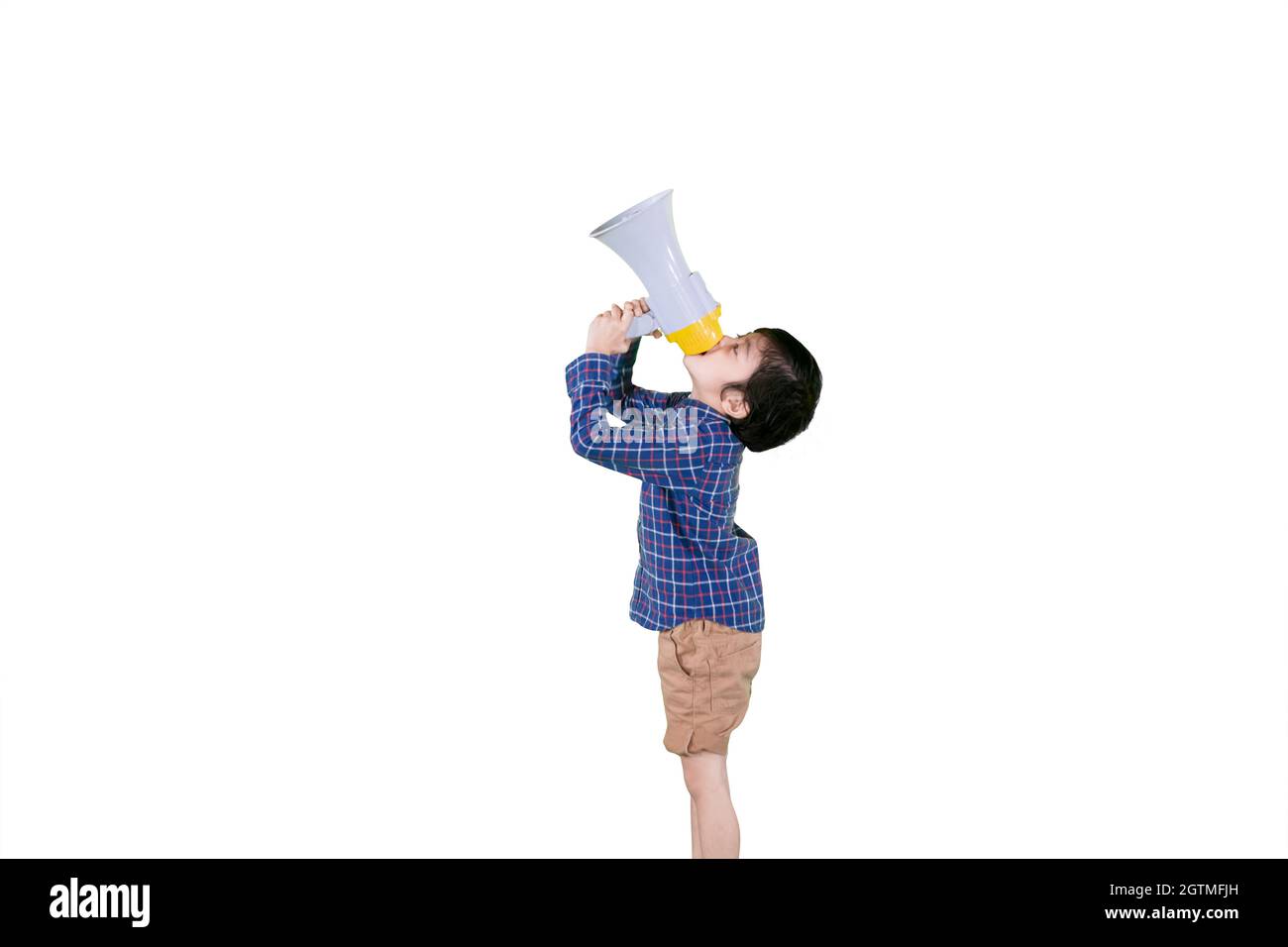 Side View Of Boy Holding Megaphone Against White Background Stock Photo ...