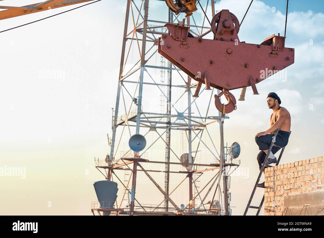 Man male standing on platform ladder hi-res stock photography and ...