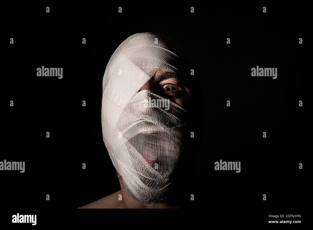 Man wrapped in bandages hi-res stock photography and images - Alamy