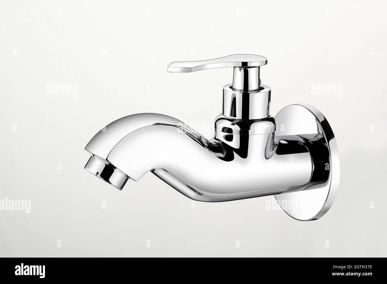 Modern stainless steel water tap. Isolated on white Grey background ...