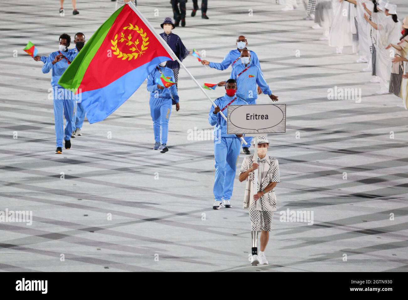 JULY 23rd, 2021 - TOKYO, JAPAN: Eritrea's flag bearers Nazret Weldu and Ghirmai Efrem enter the ...