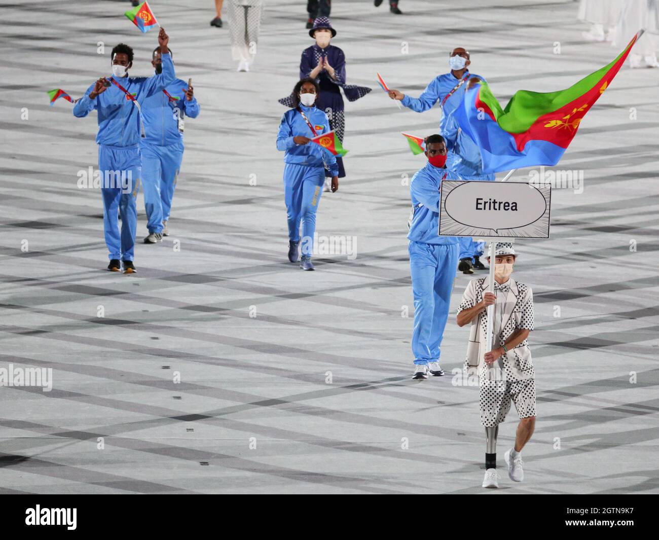 JULY 23rd, 2021 - TOKYO, JAPAN: Eritrea's flag bearers Nazret Weldu and Ghirmai Efrem enter the ...