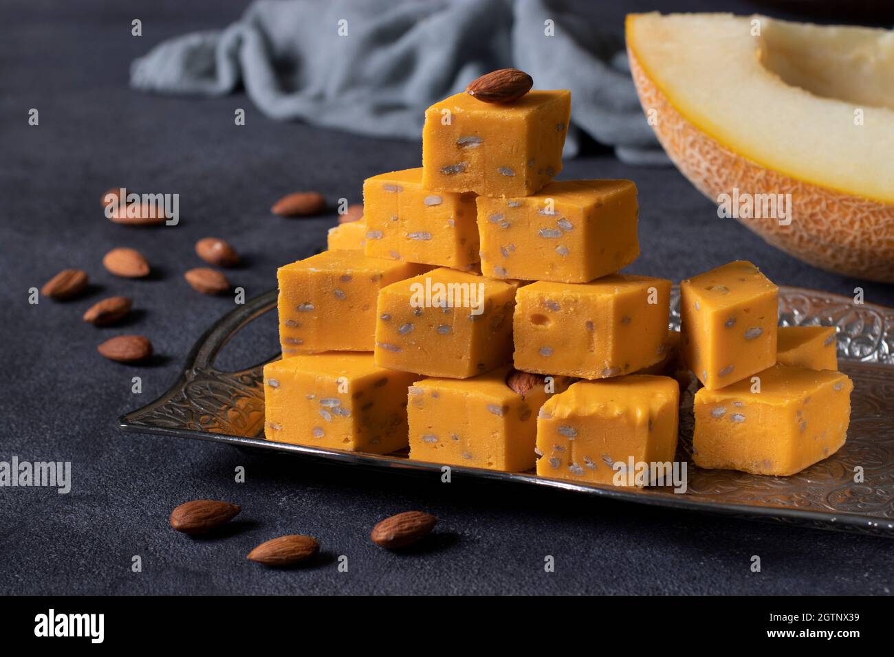 Delicious slices of Oriental milk halva with melon flavor, sunflower ...