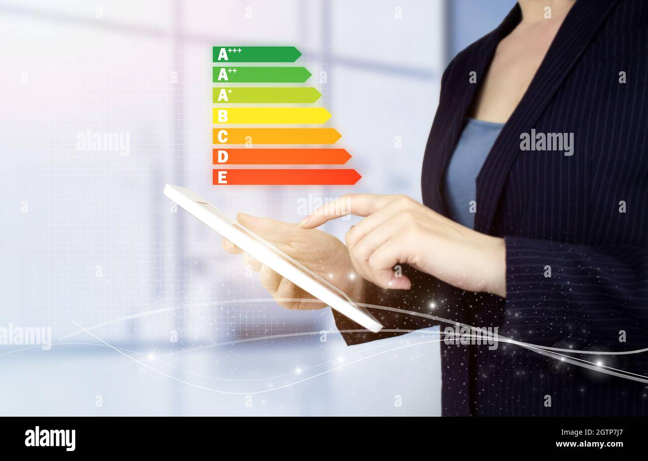 Energy efficiency concept. Hand touch white tablet with digital ...