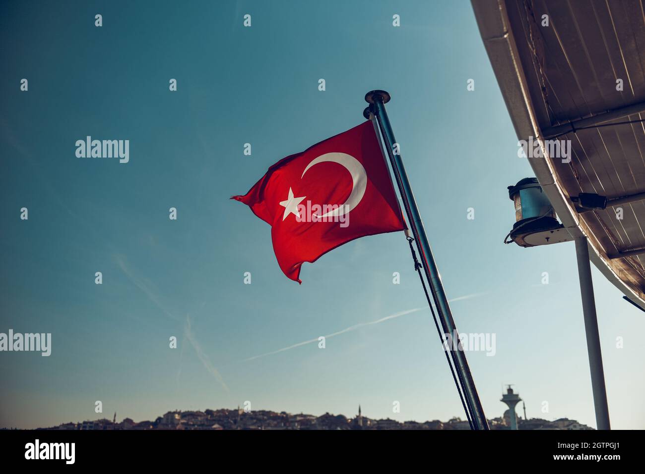 Turkish flag waving in blue sky Stock Photo - Alamy