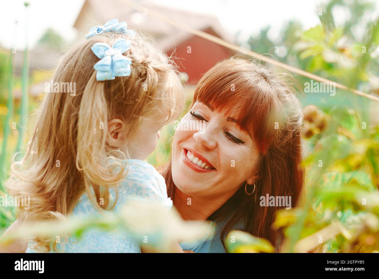 mom hugs her daughter in nature Stock Photo - Alamy