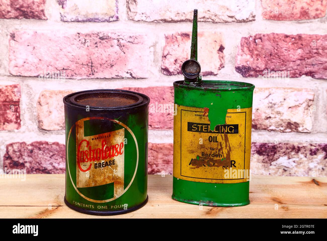 Vintage one pound can of Castrol grease and an old Sterling oil can sat ...