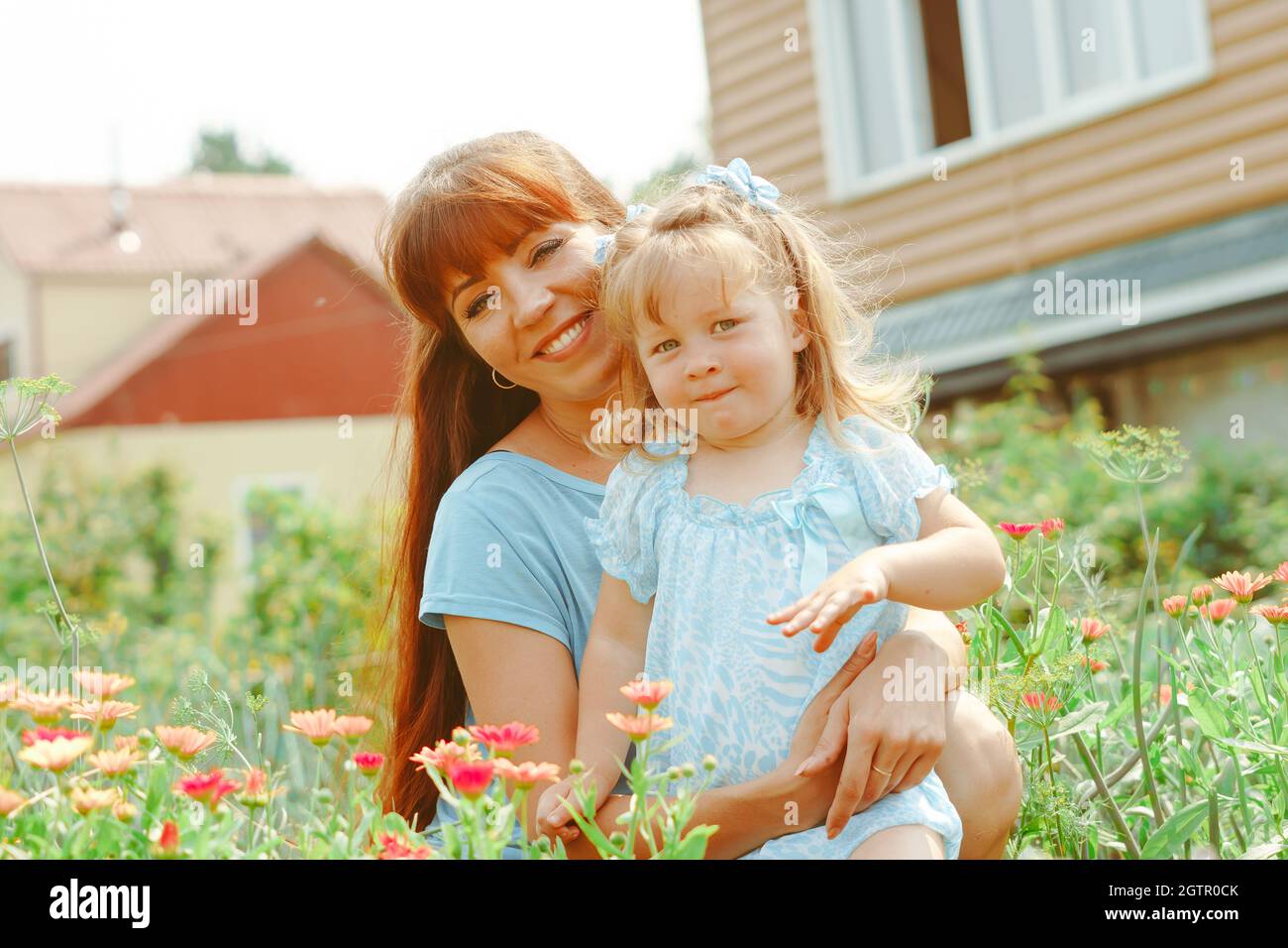mom hugs her daughter in nature Stock Photo - Alamy