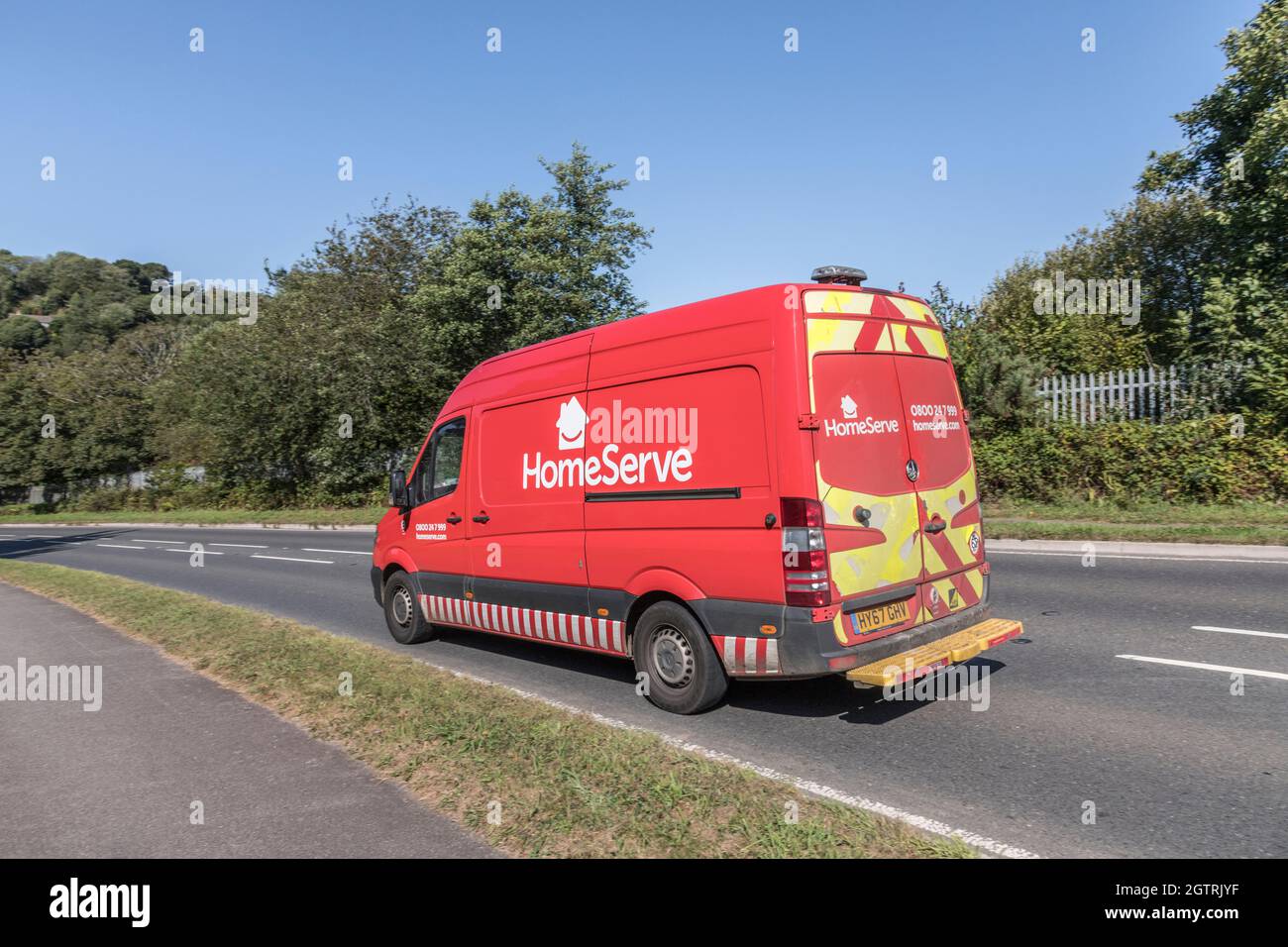 Red van travelling downhill hi-res stock photography and images - Alamy