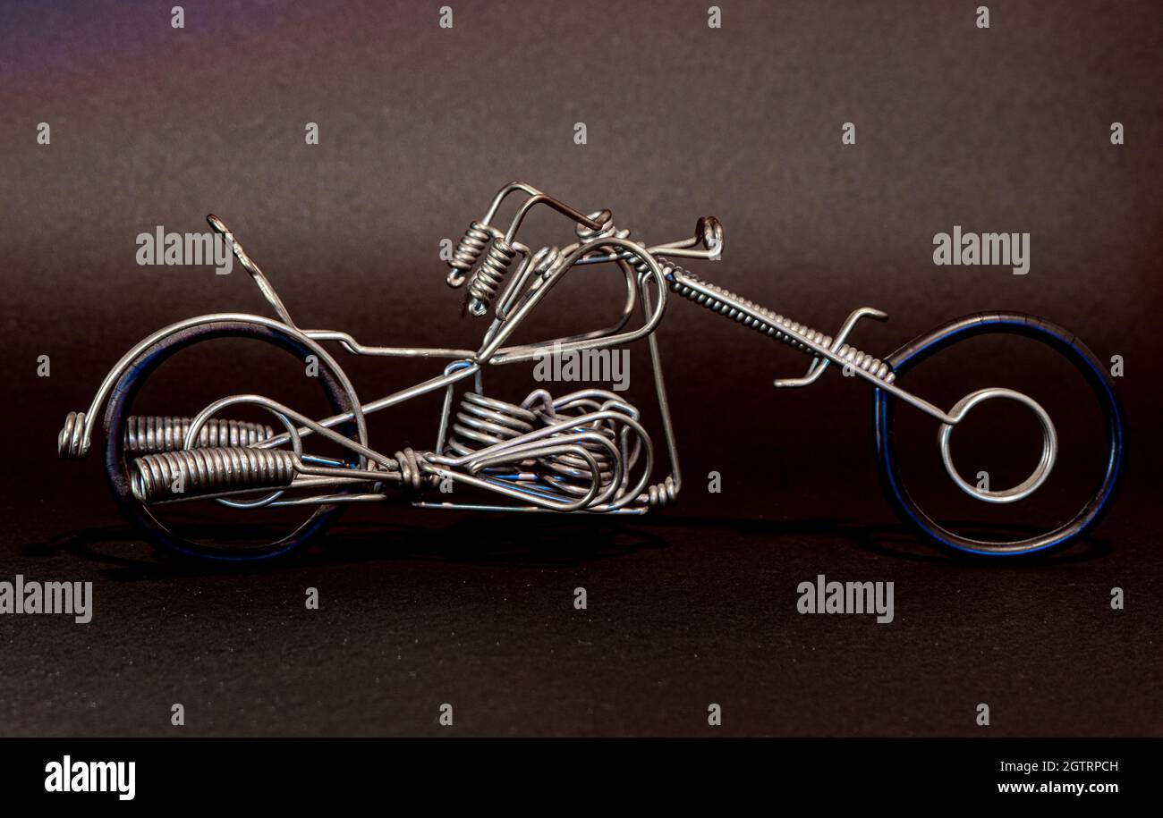 motorcycle made of wire with a dark background Stock Photo - Alamy