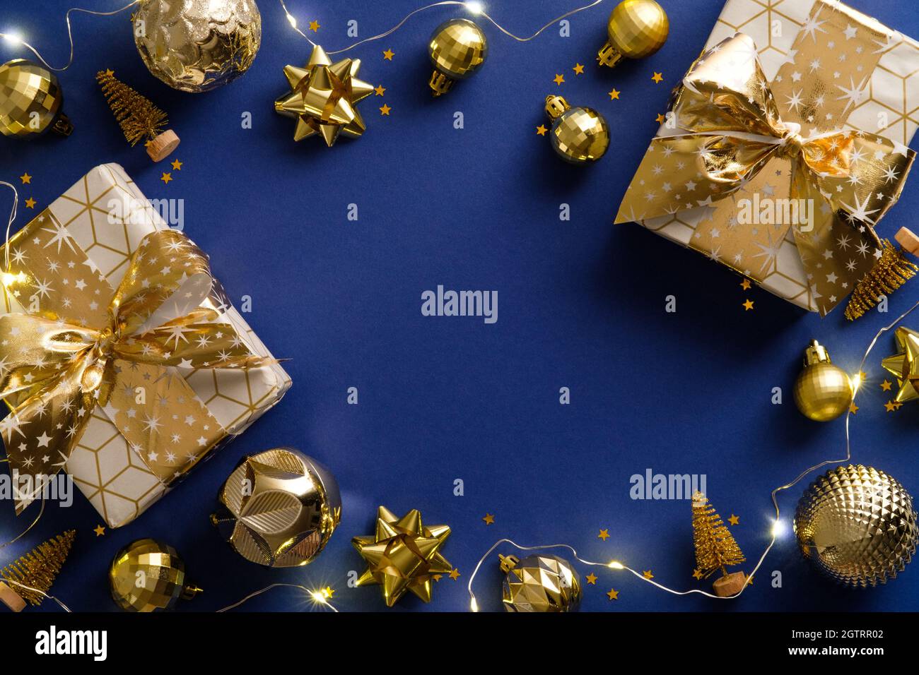Luxury Christmas frame border. Flat lay gift boxes, golden decorations ...