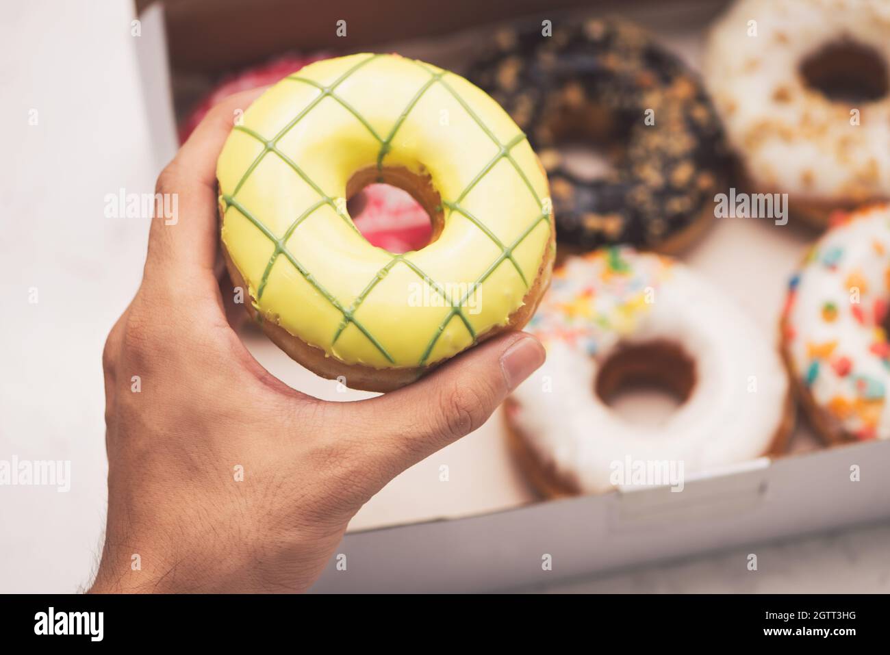 Holding box donuts hi-res stock photography and images - Alamy