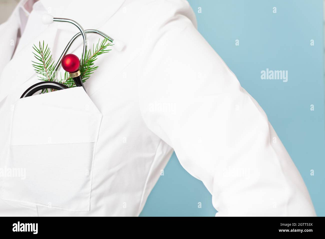 Doctor with stethoscope with christmas's ball instead of instrument ...