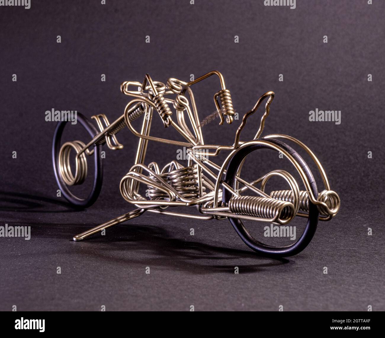 motorcycle made of wire with a dark background Stock Photo - Alamy
