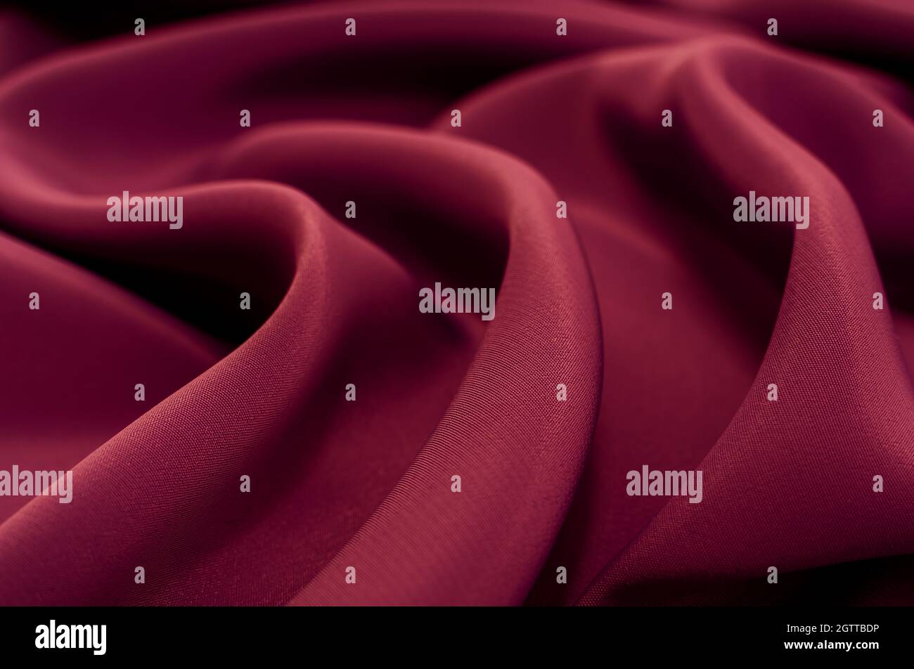 A piece of burgundy, red cloth. Fabric texture for background and ...