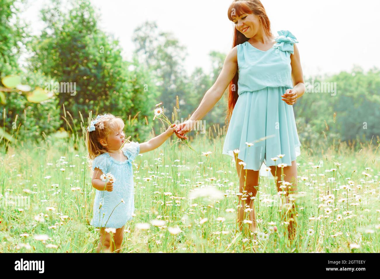 mom hugs her daughter in nature Stock Photo - Alamy