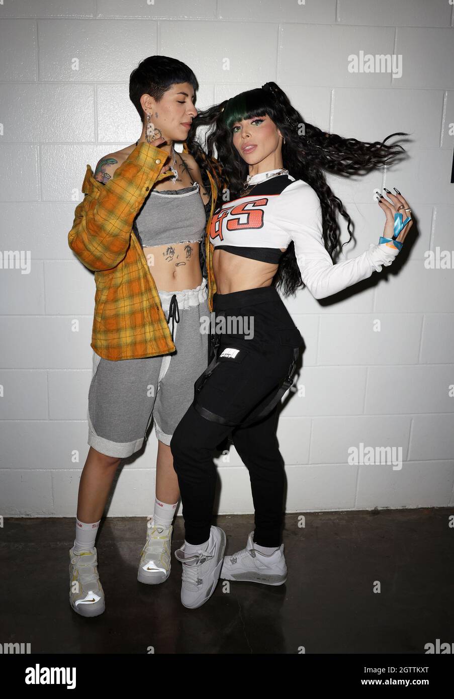 MIAMI, FL - OCTOBER 1: Cazzu and Chesca pose backstage during Uforia ...