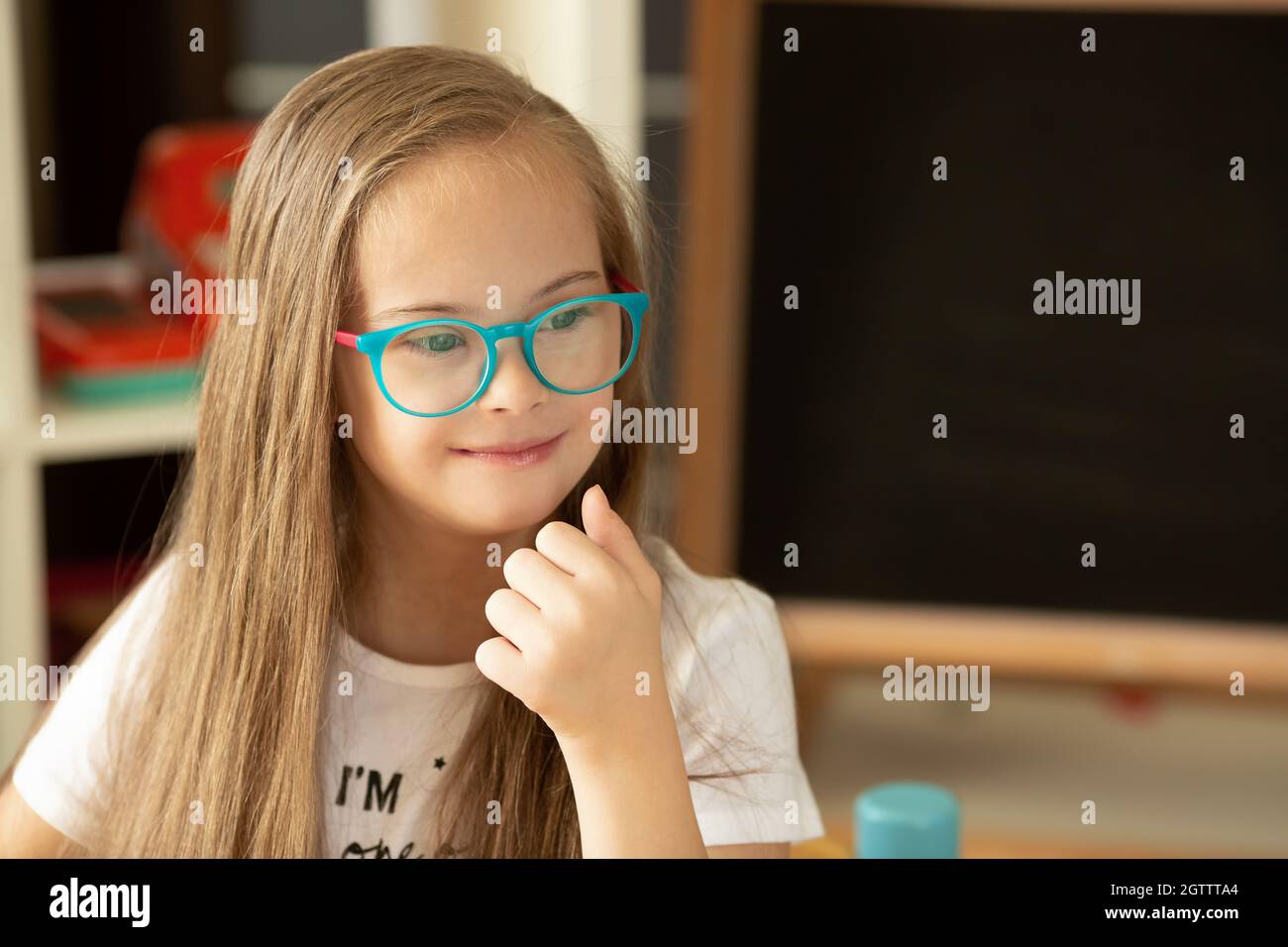 A girl with Down syndrome experiences positive emotions and joy Stock ...