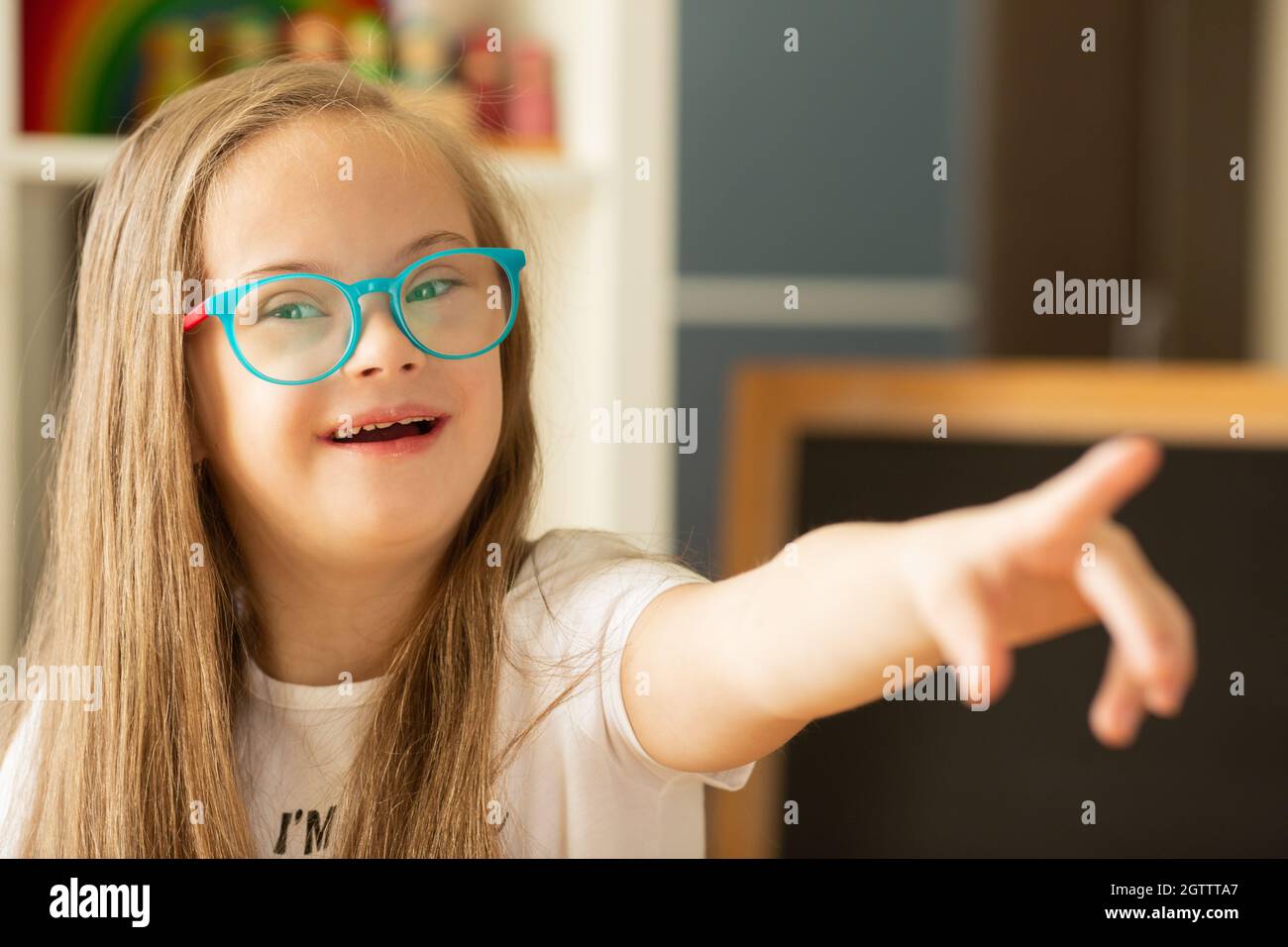 A girl with Down syndrome experiences positive emotions and joy Stock ...