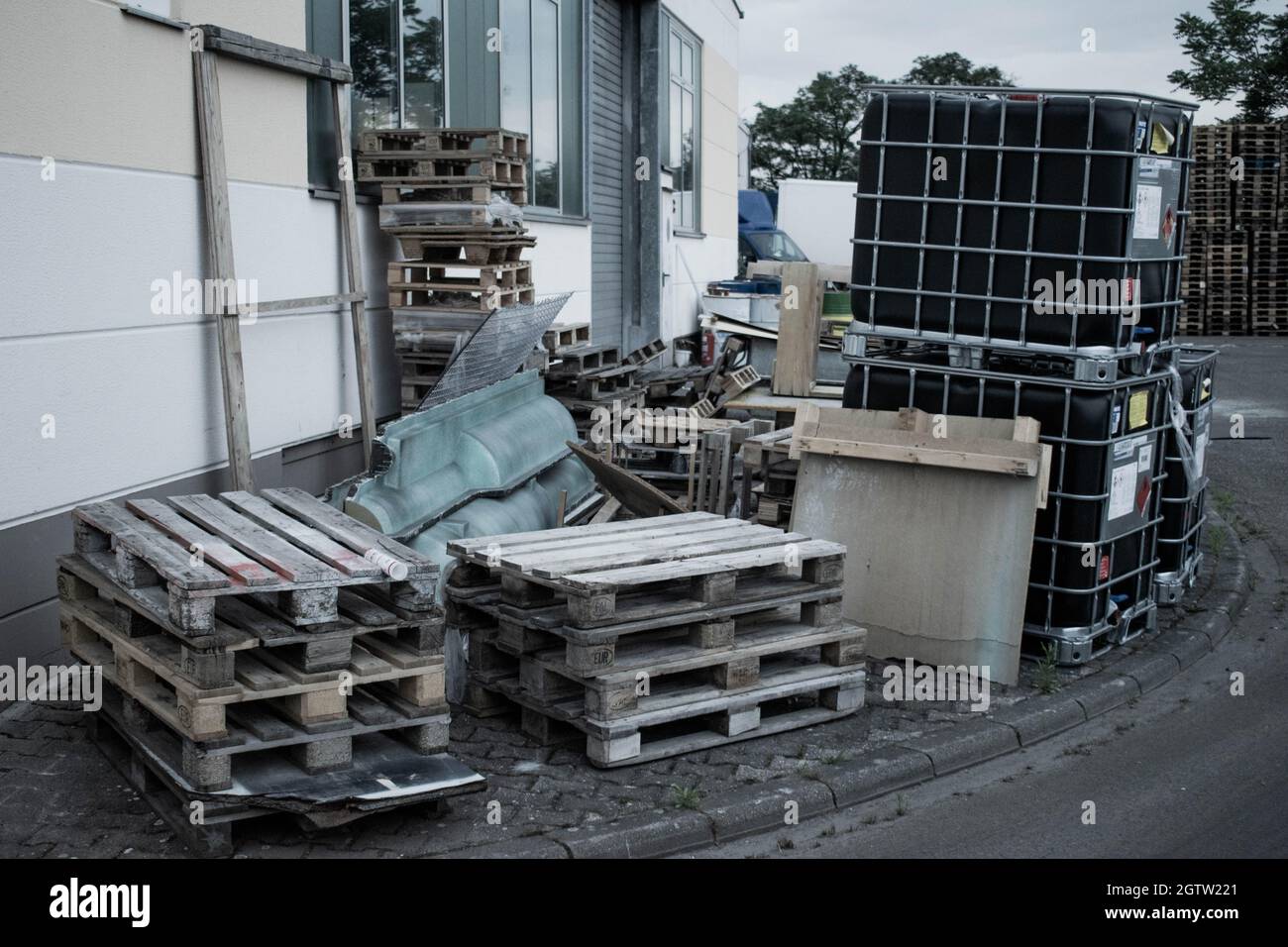 Stack Of Garbage By Building In City Stock Photo - Alamy