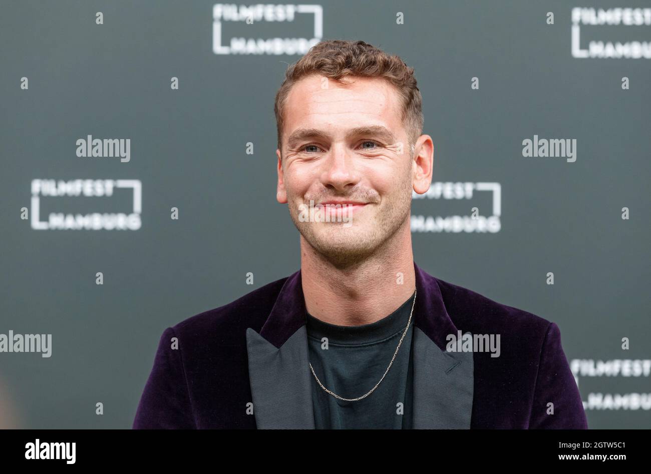 Hamburg, Germany. 02nd Oct, 2021. Actor Louis Nitsche stands on the red ...