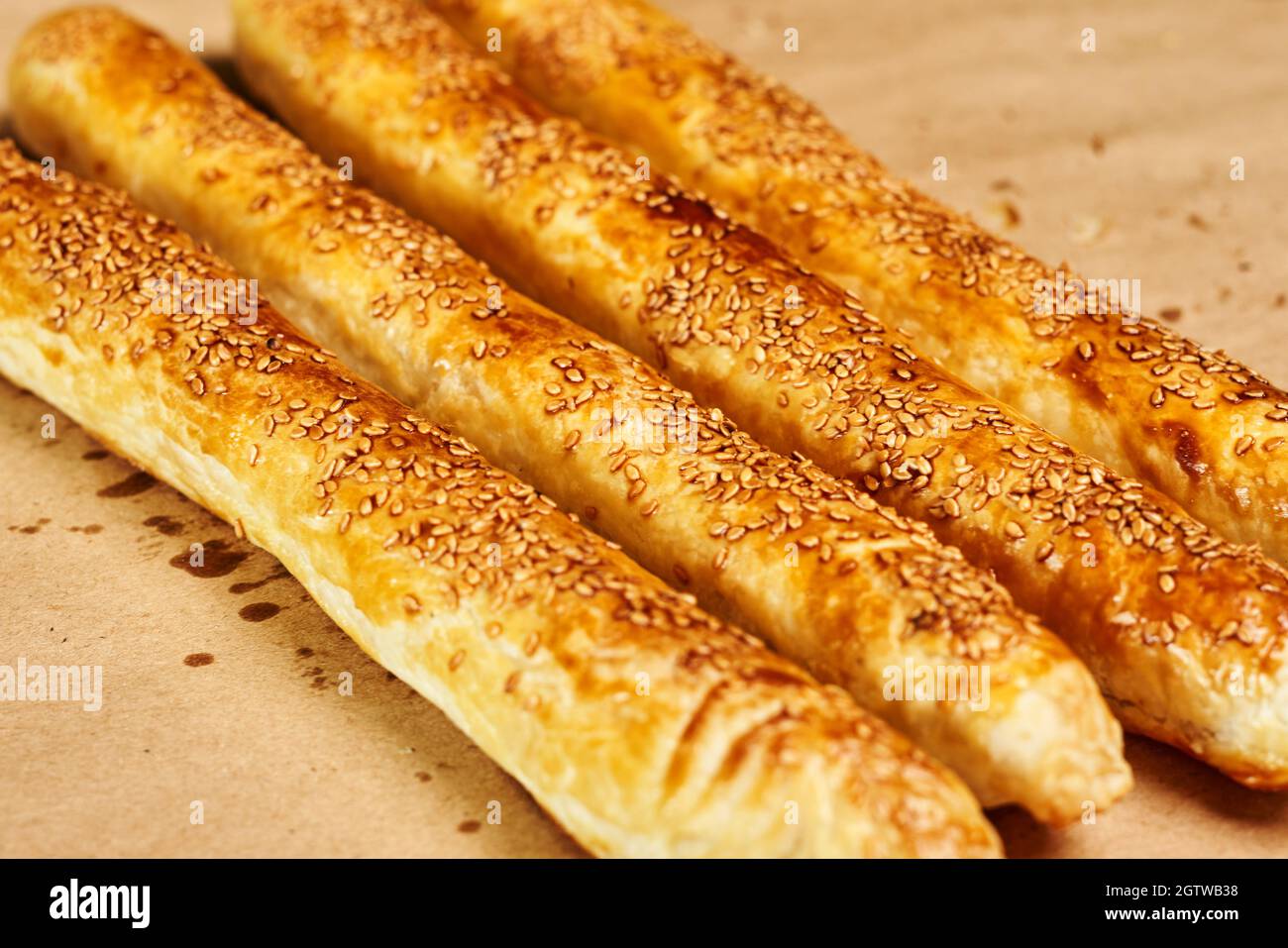 Fresh breadsticks on a brown paper Stock Photo - Alamy