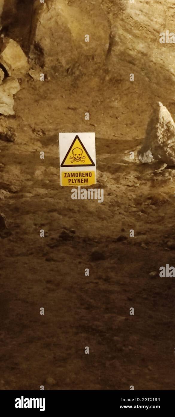 Vertical shot of infested with gas sign in a cave Stock Photo - Alamy