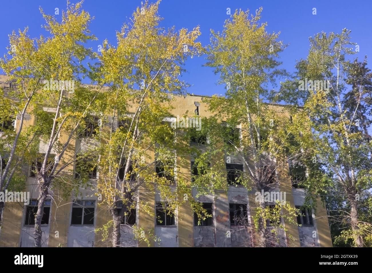 The ruins of a destroyed building in the city. Old abandoned collapsing ...