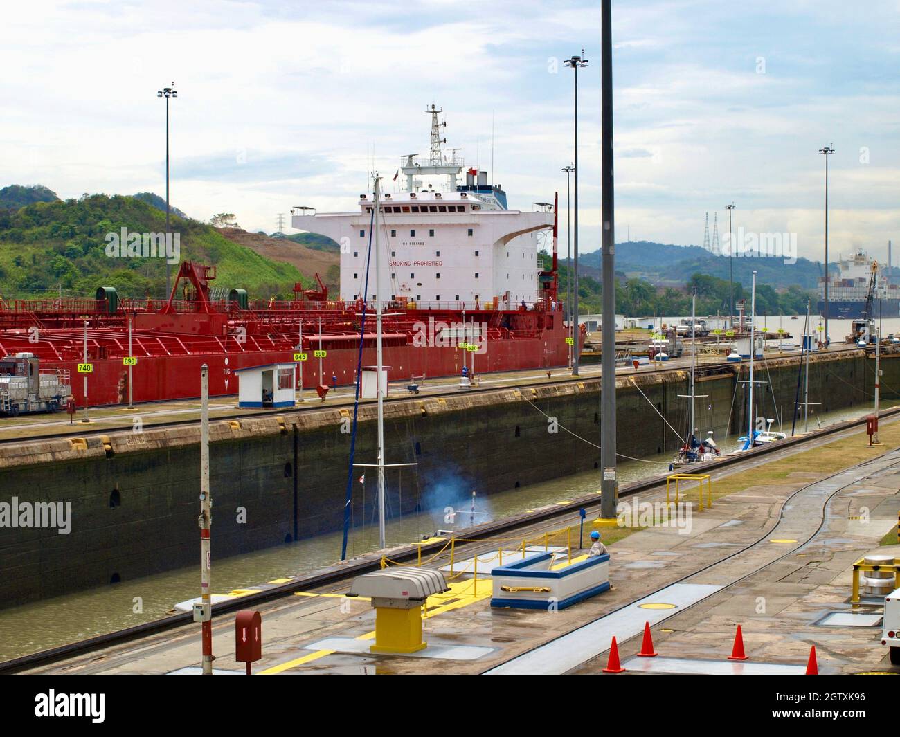 A tanker crossing the Panama Canal at the Miraflores lock in Panama ...