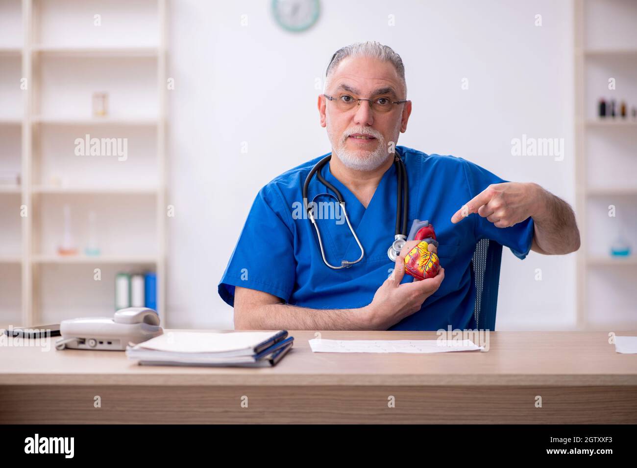 Experienced male doctor cardiologist working in the clinic Stock Photo ...
