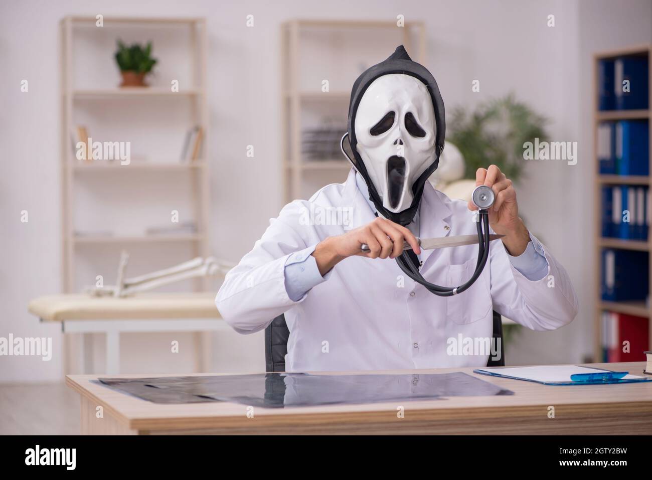 Devil doctor working at the hospital Stock Photo - Alamy
