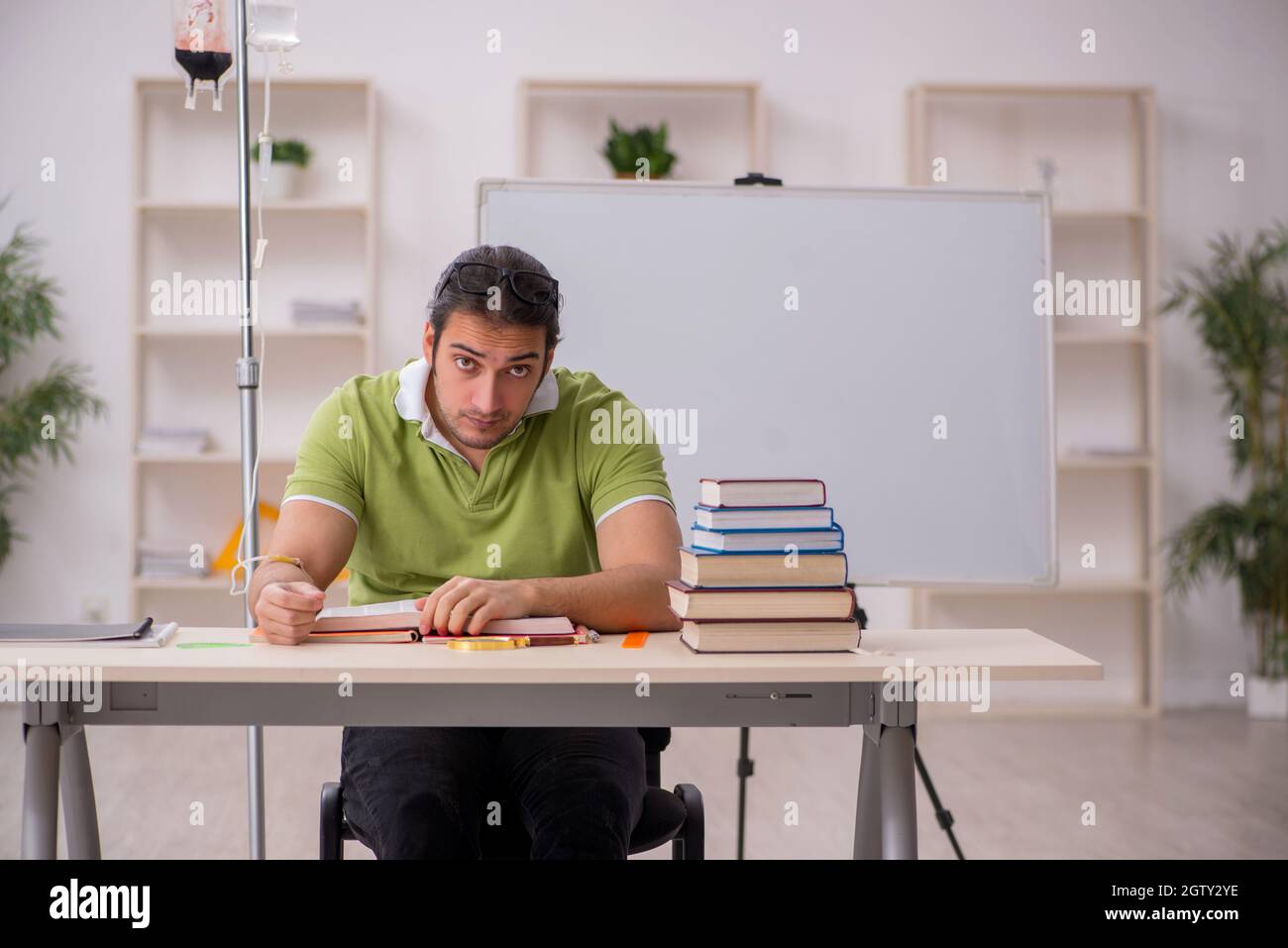 Young sick teacher student in blood transfusion concept Stock Photo - Alamy